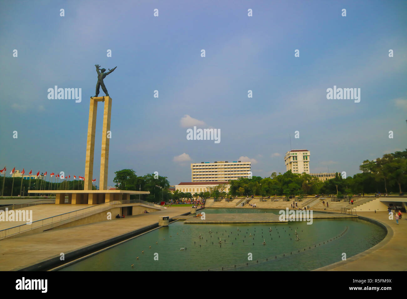 a charming sky and freedom statue at Lapangan Banteng Stock Photo - Alamy