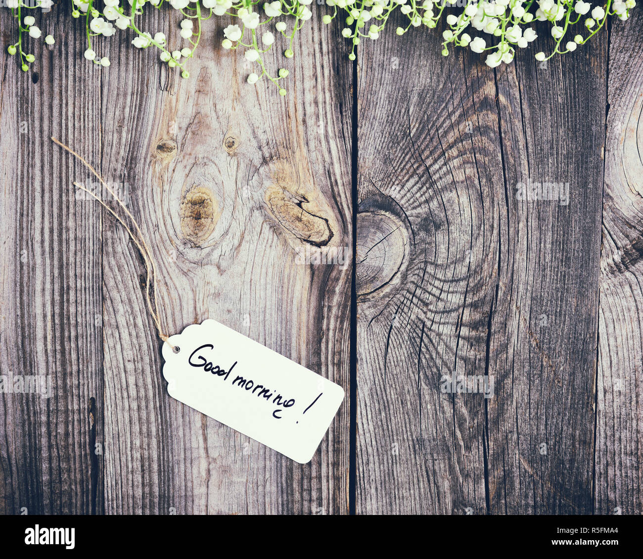 Gray wood background with paper tag Stock Photo - Alamy