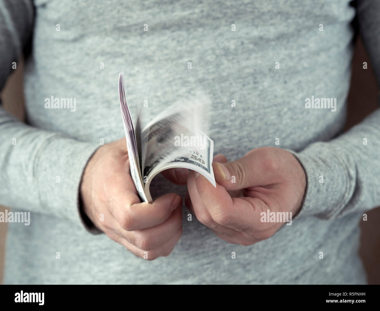 Hands counting dollars Stock Photo - Alamy