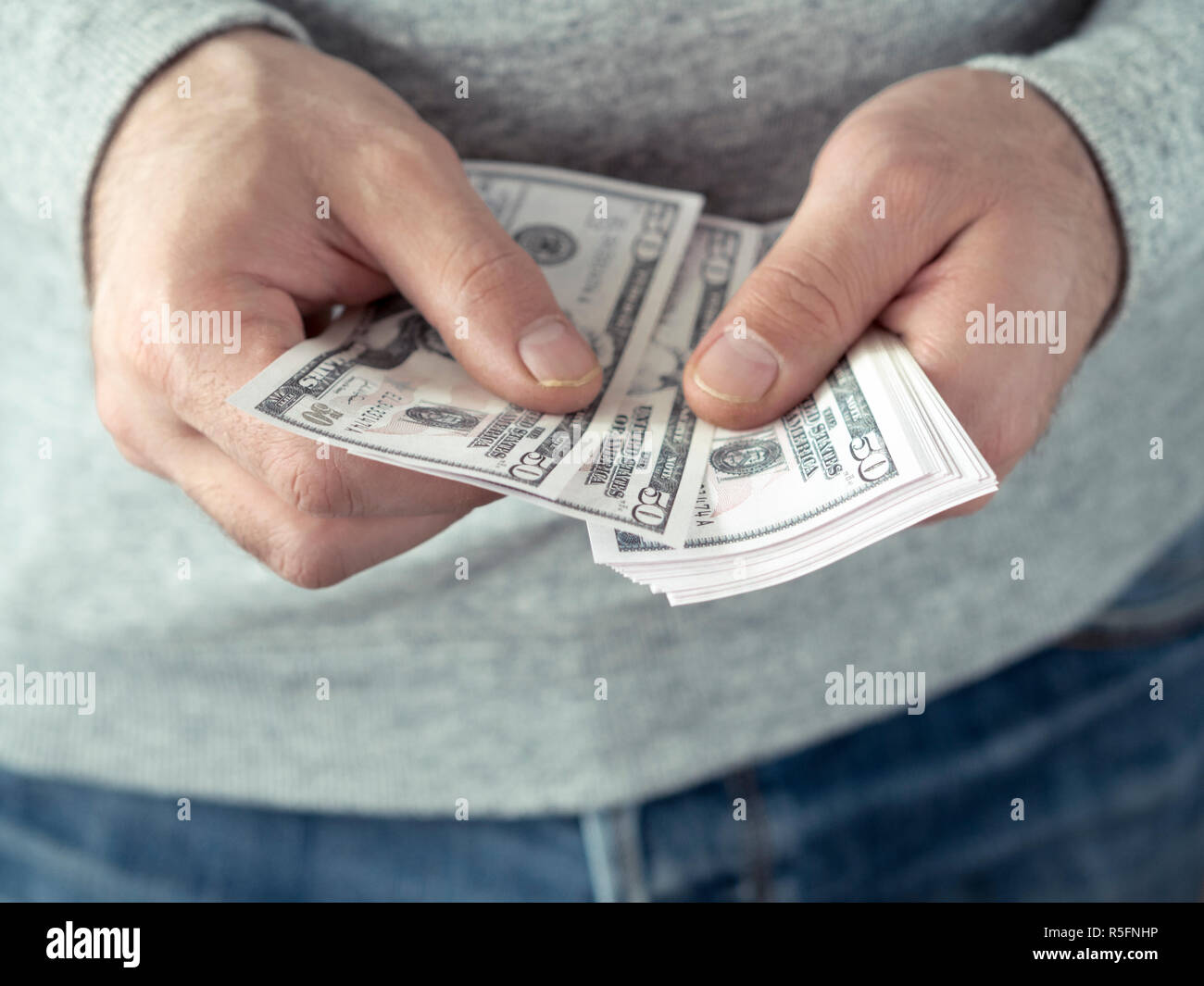 Hands counting dollars Stock Photo - Alamy