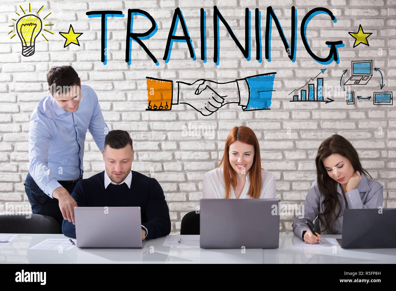 Businessman Giving Training To His Coworker Stock Photo - Alamy