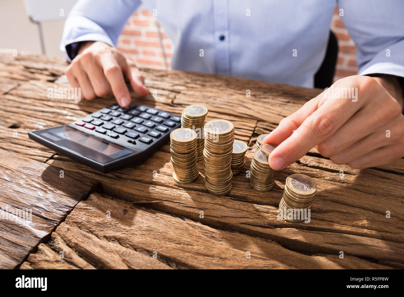 Person Calculating Using Calculator Stock Photo - Alamy