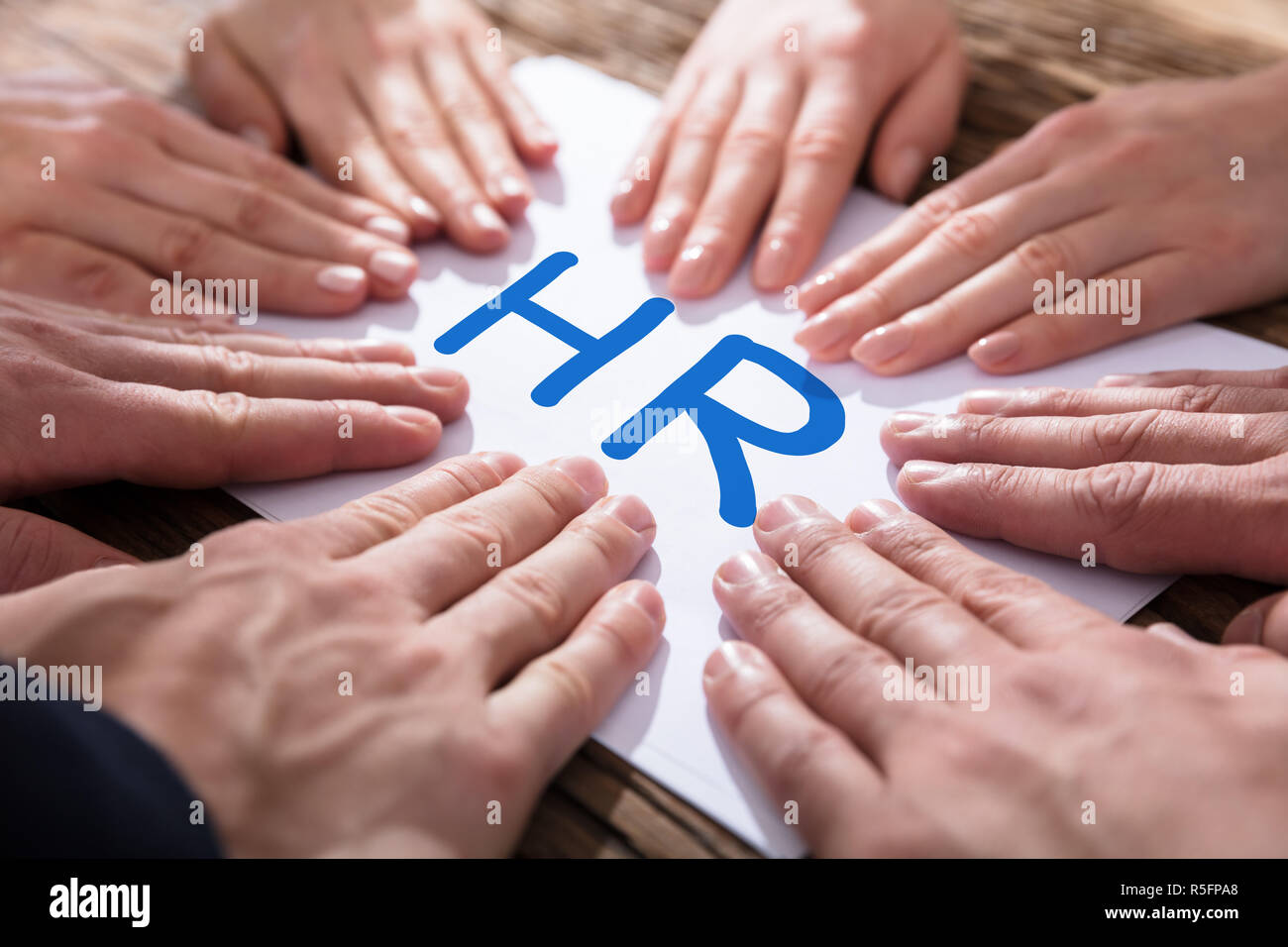 Hands On Paper Showing Hr Concept Stock Photo - Alamy