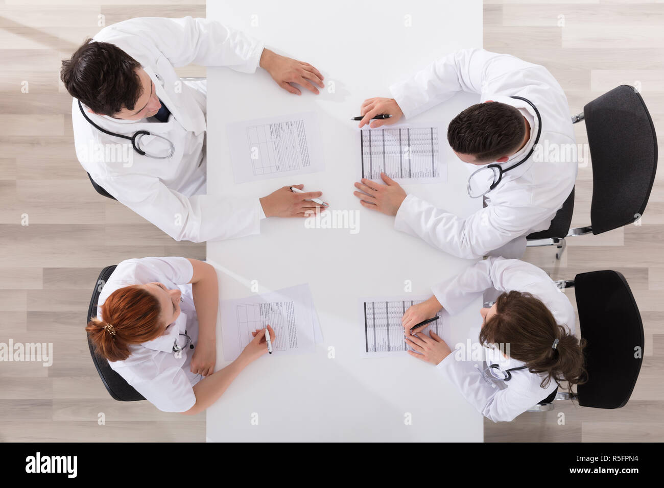 Doctors Making Discussion Stock Photo - Alamy