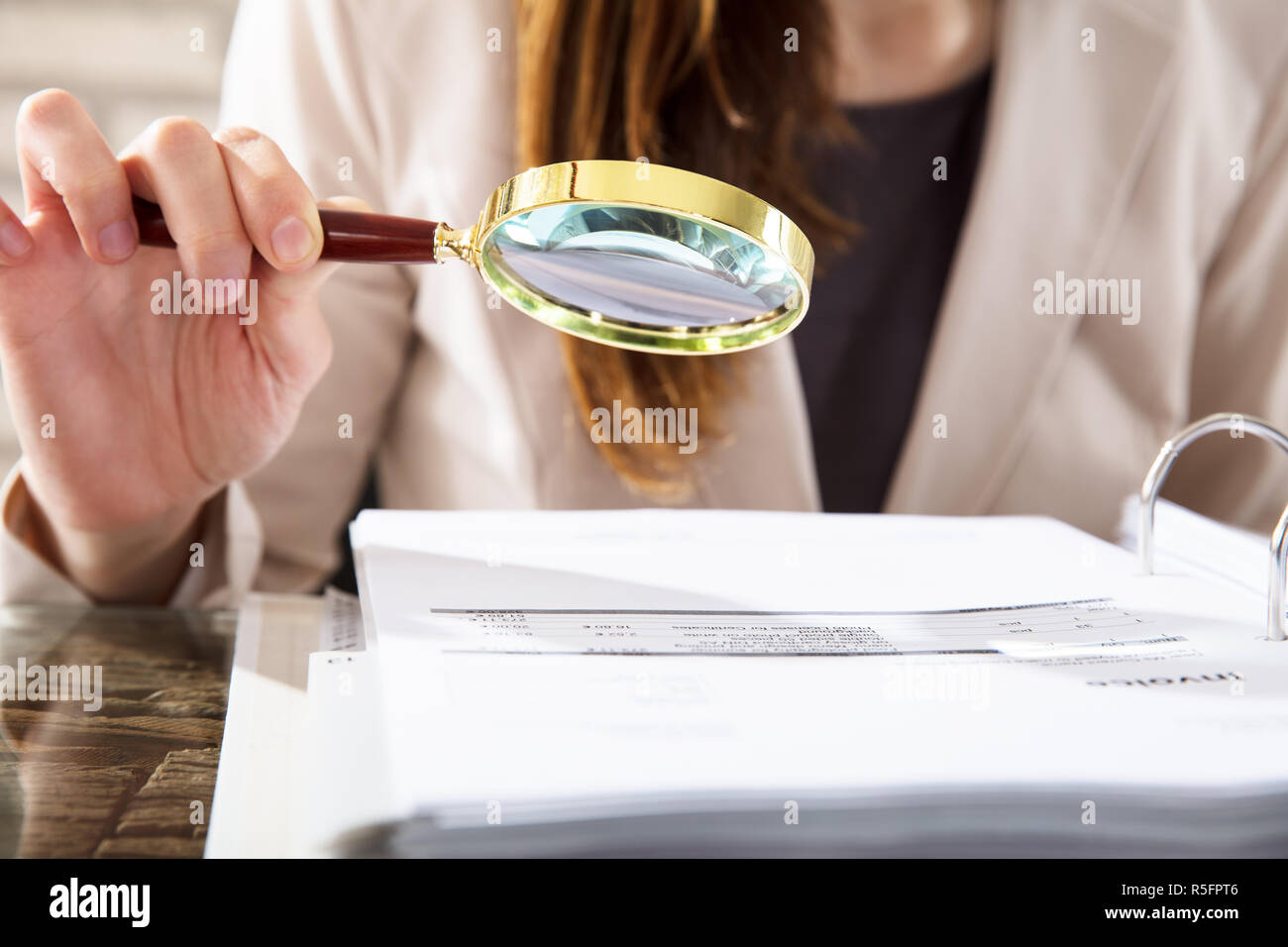 Female auditor checking invoice hi-res stock photography and images - Alamy