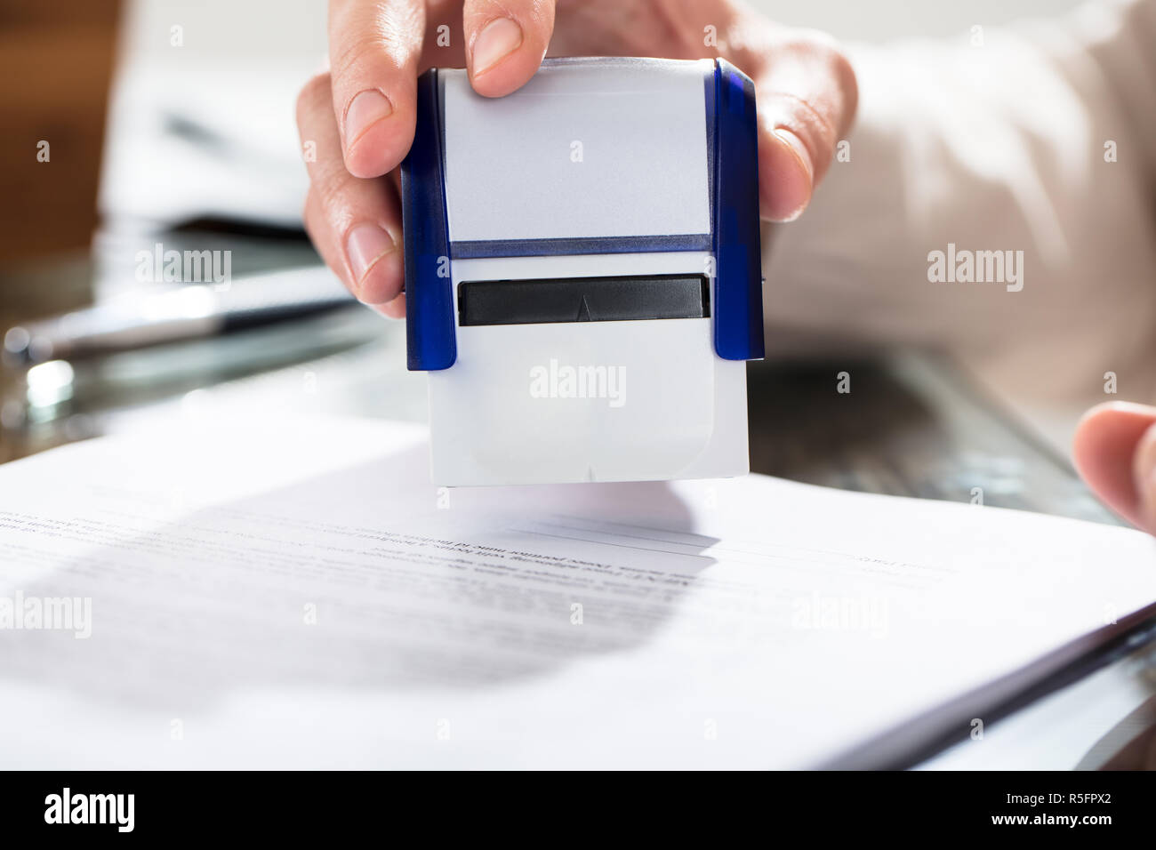 Businessperson stamping document hi-res stock photography and images - Alamy