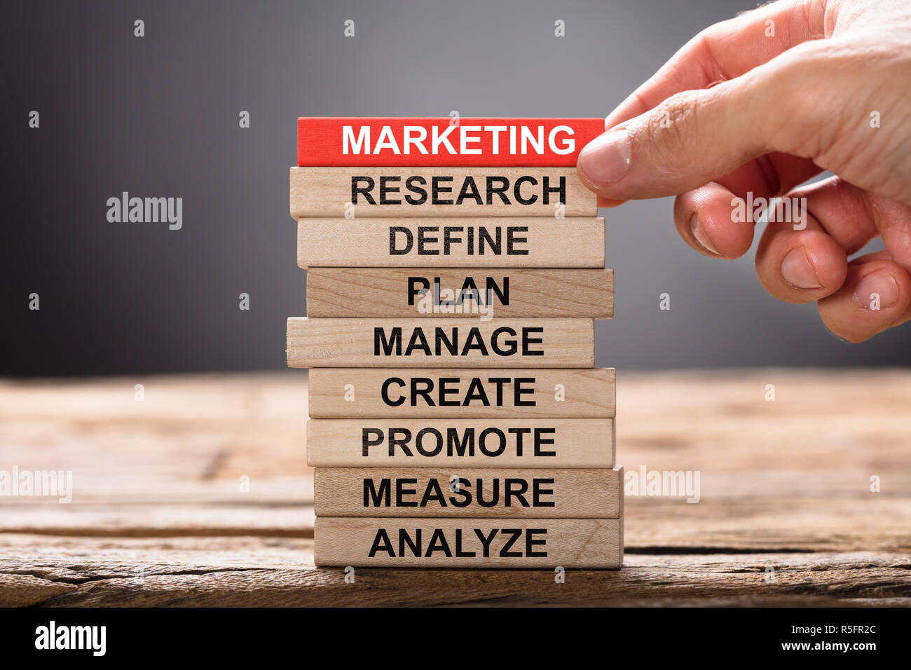 Hand Building Marketing Concept With Wooden Blocks Stock Photo - Alamy