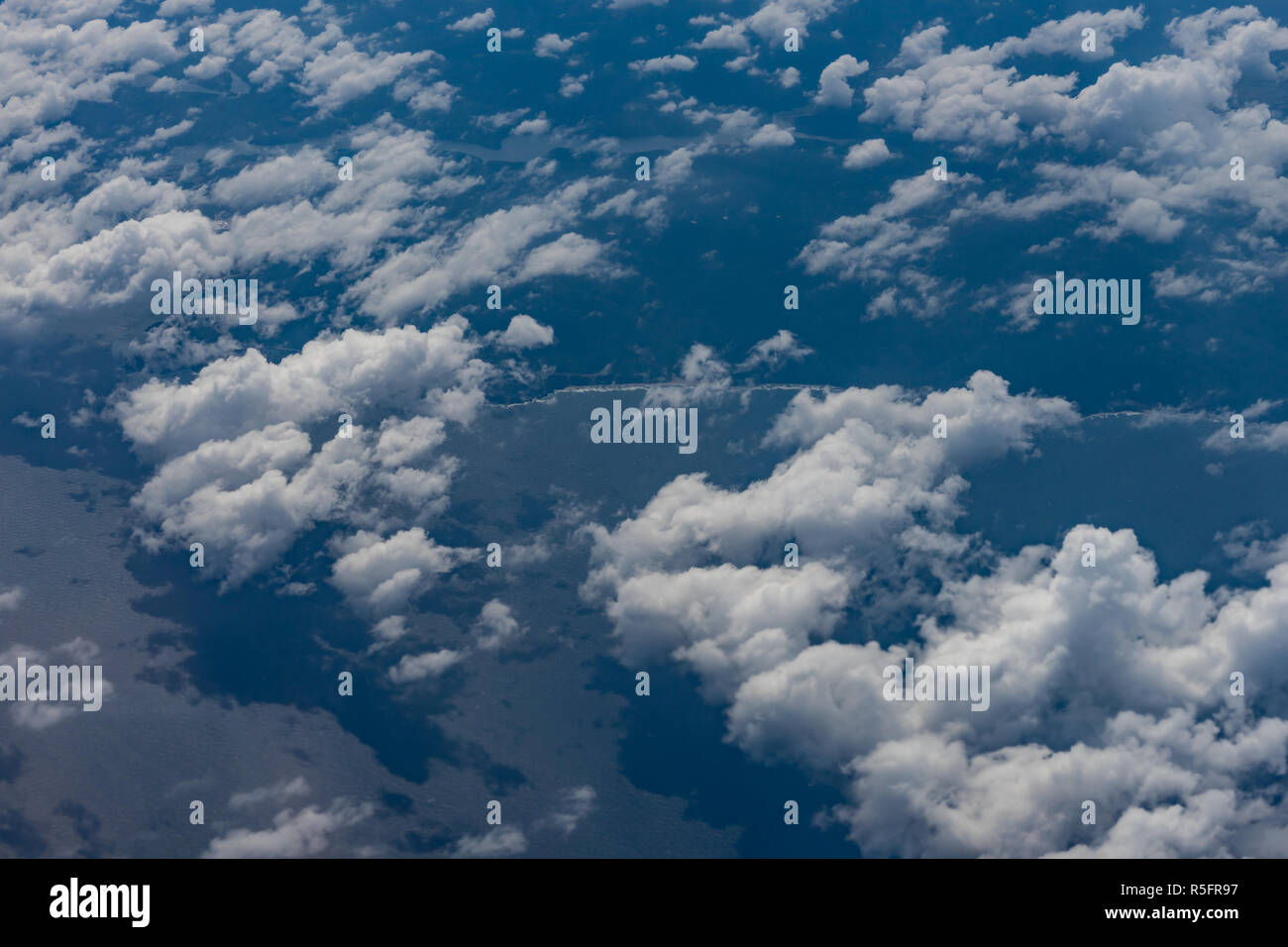 Blue sky high view from airplane clouds Stock Photo - Alamy