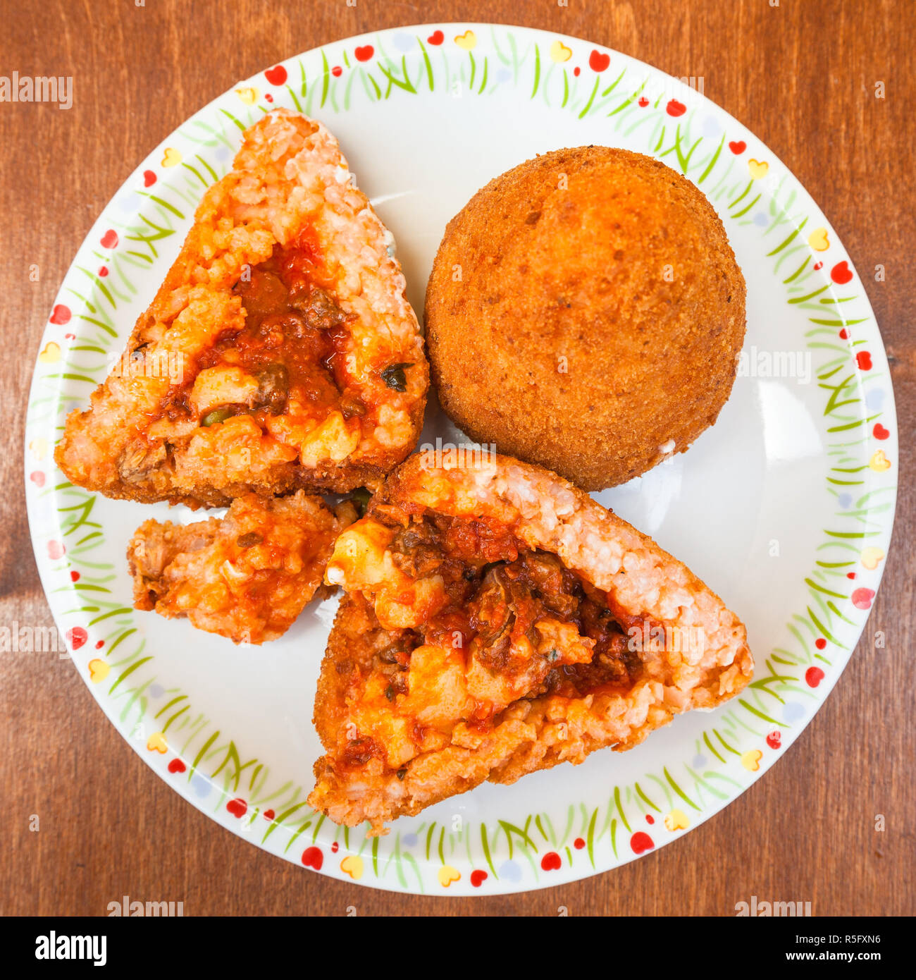 top view of meat ragu stuffed rice balls arancini Stock Photo - Alamy