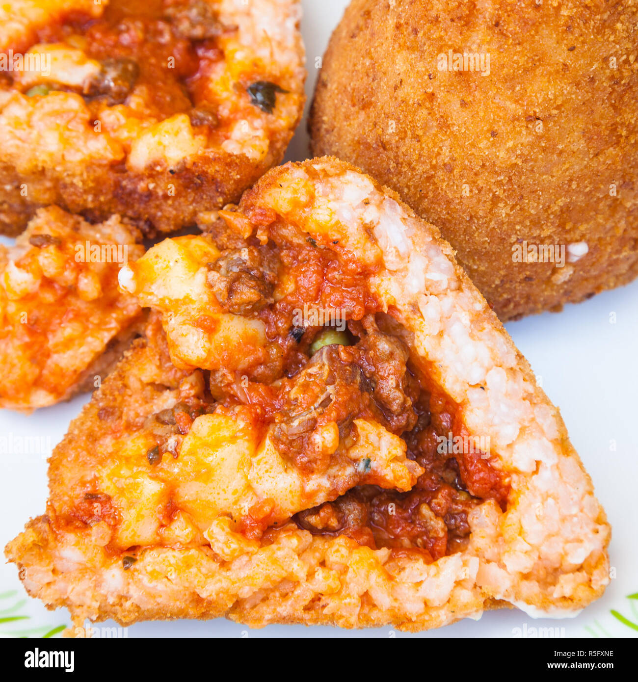 open meat ragu stuffed rice balls arancini Stock Photo - Alamy