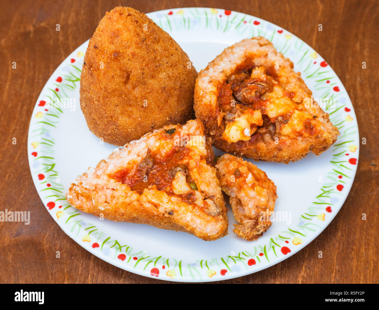 meat ragu stuffed rice balls arancini on plate Stock Photo - Alamy