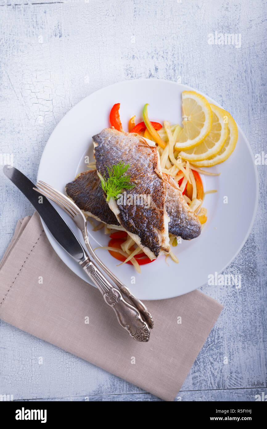 Sea Bream fish with vegetables Stock Photo - Alamy