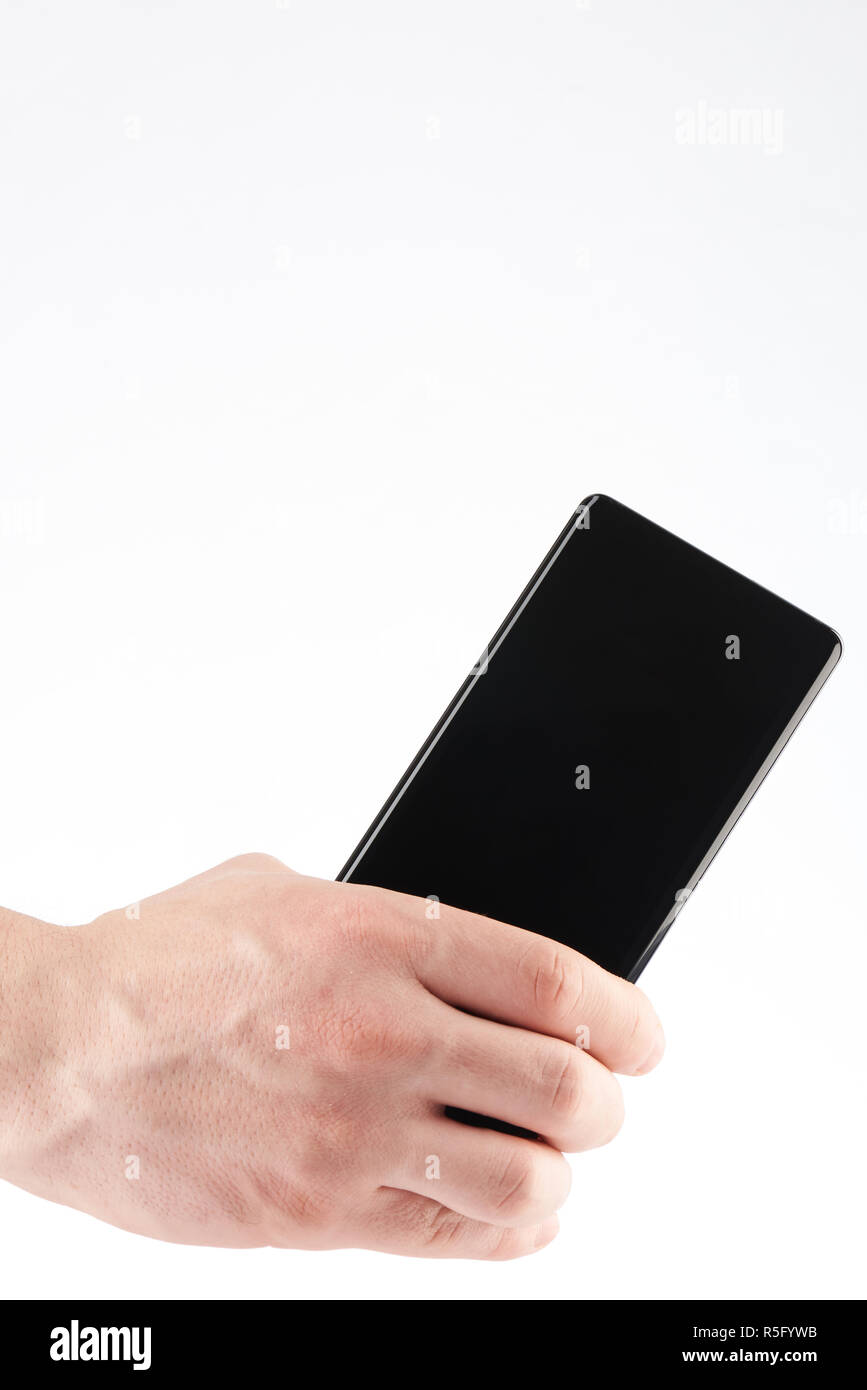 Close-up of back modern smartphone in hand isolated on white background ...
