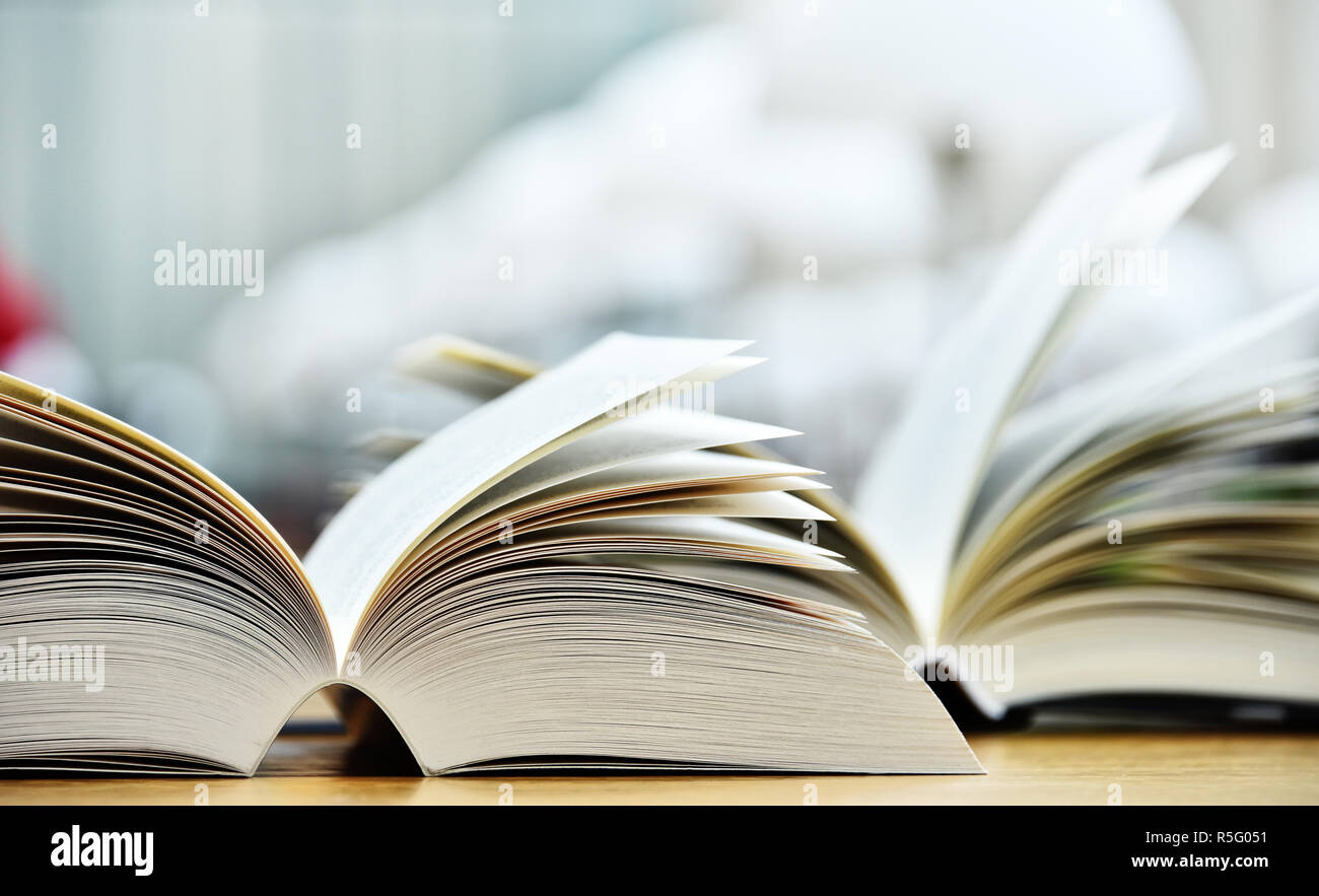 Books lying on the table in the public library Stock Photo - Alamy