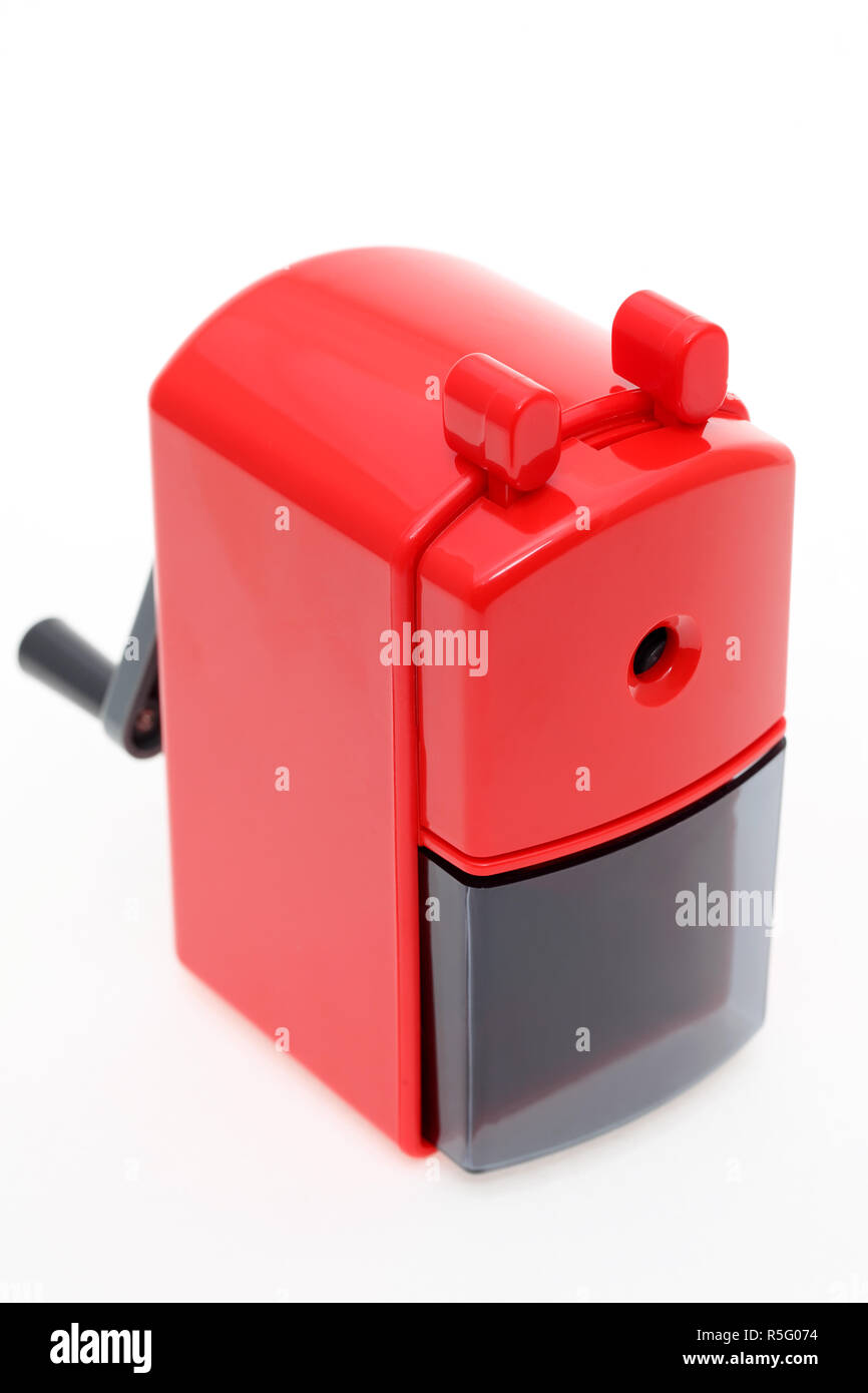 Red plastic pencil sharpener on white background Stock Photo - Alamy