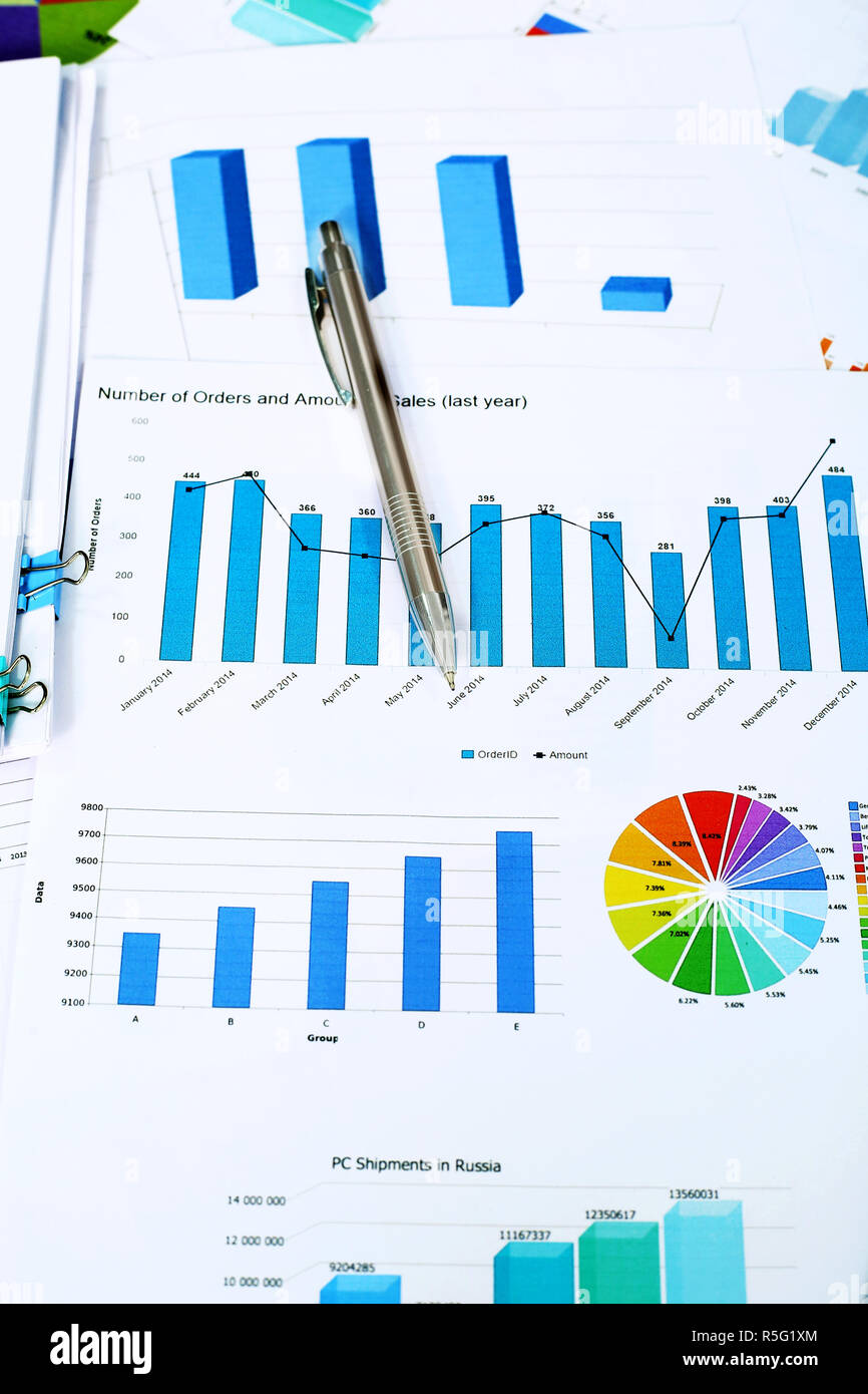 Picture of pen and financial graph paper Stock Photo - Alamy