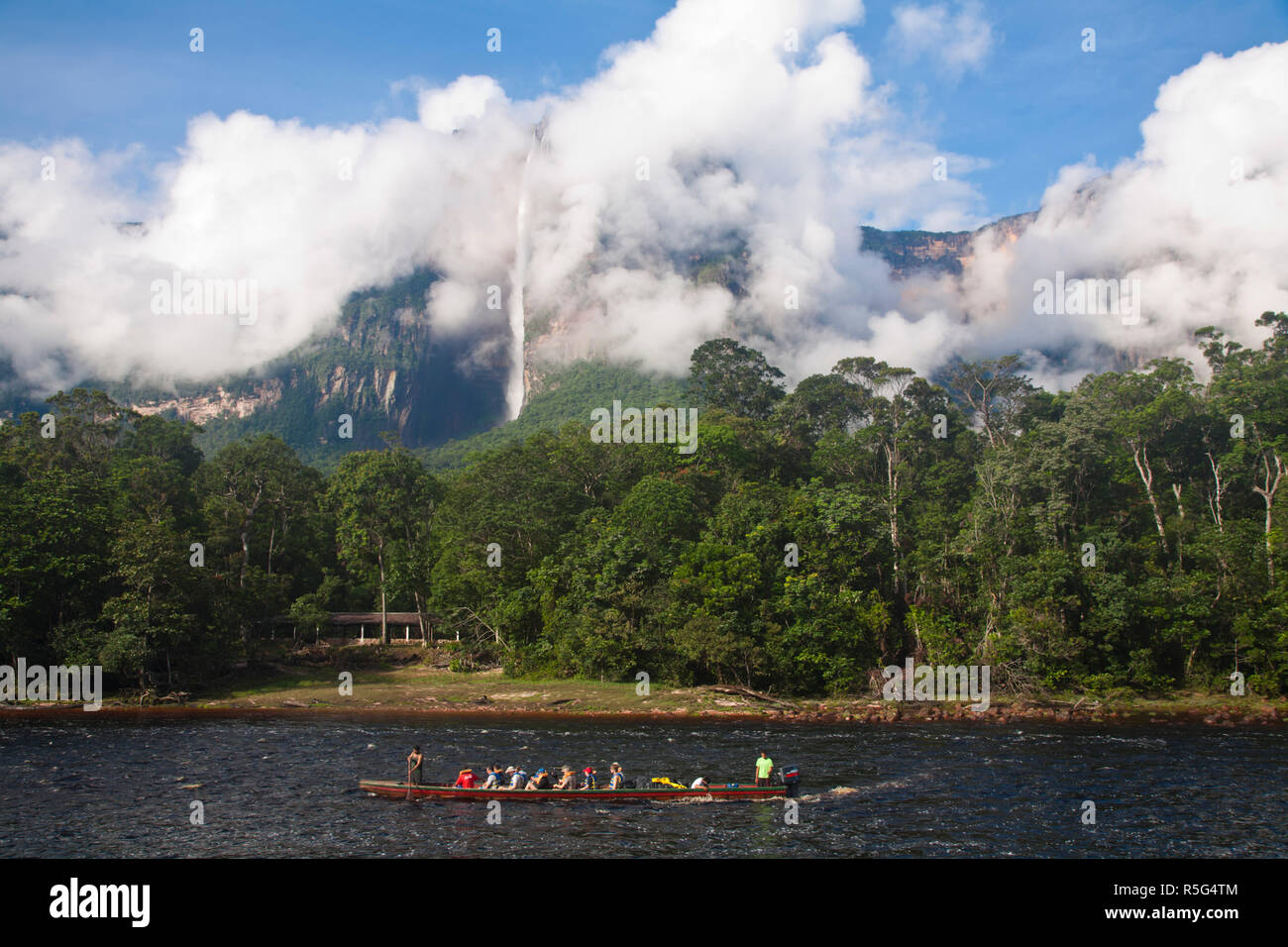 Venezuela, Guayana, Canaima National Park, Tourist on boat on River ...
