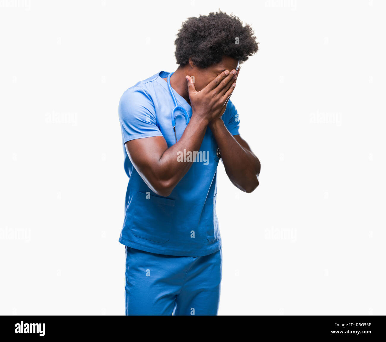 Afro american surgeon doctor man over isolated background with sad ...