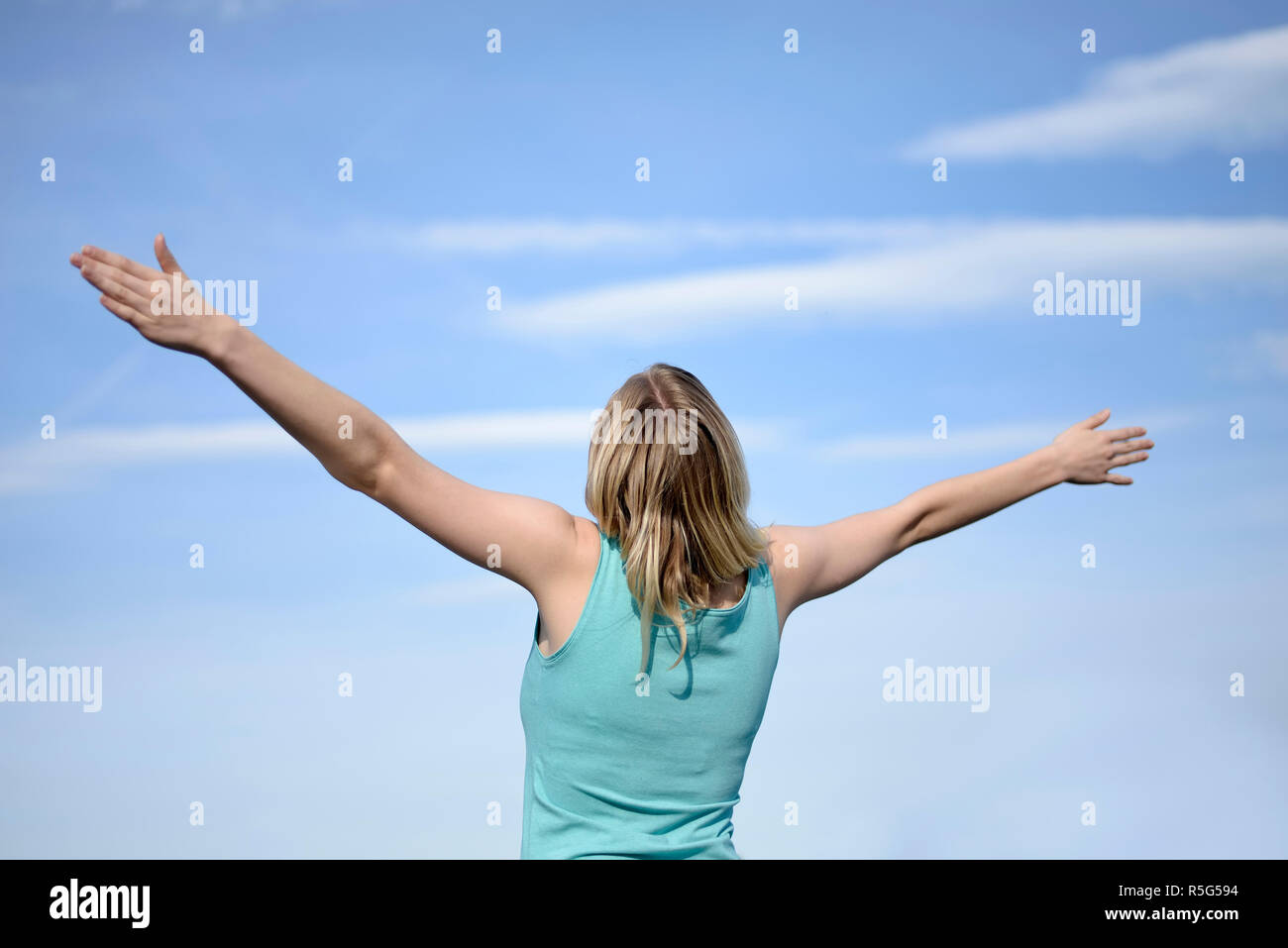 young woman cheers Stock Photo - Alamy