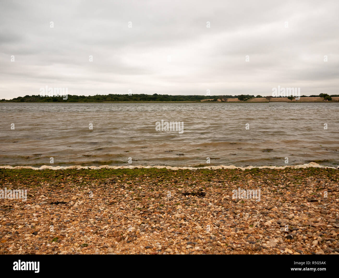 Textured Layers of a Sea Shore Overcast and Waves, sand and Pebbles ...