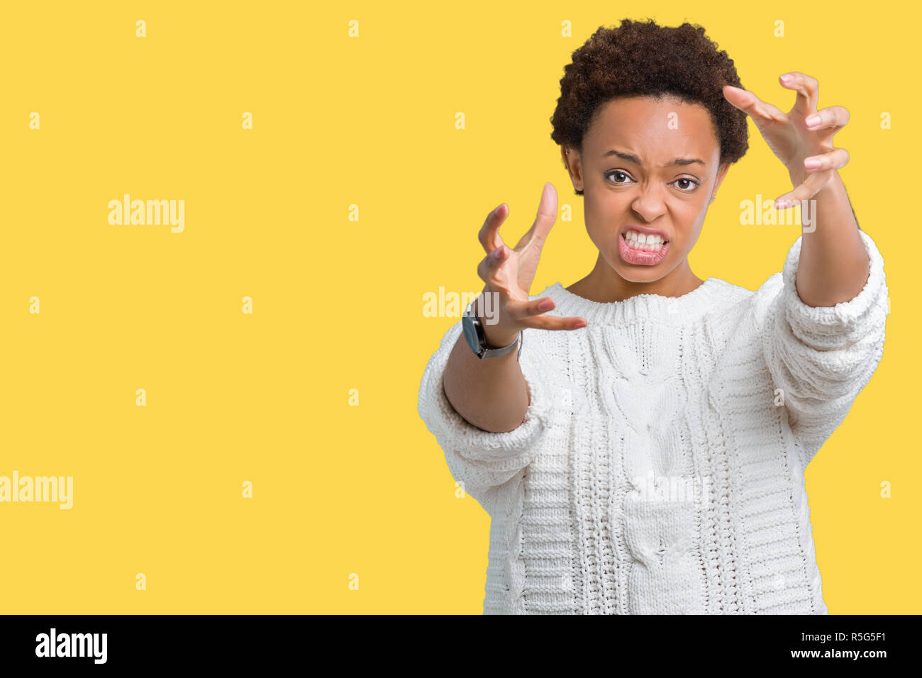 Beautiful young african american woman wearing sweater over isolated ...