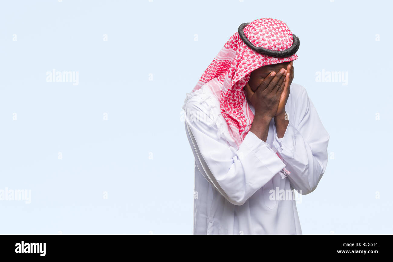 Young arabic african man wearing traditional keffiyeh over isolated ...