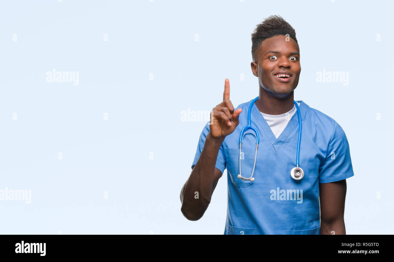 Young african american doctor man over isolated background wearing ...