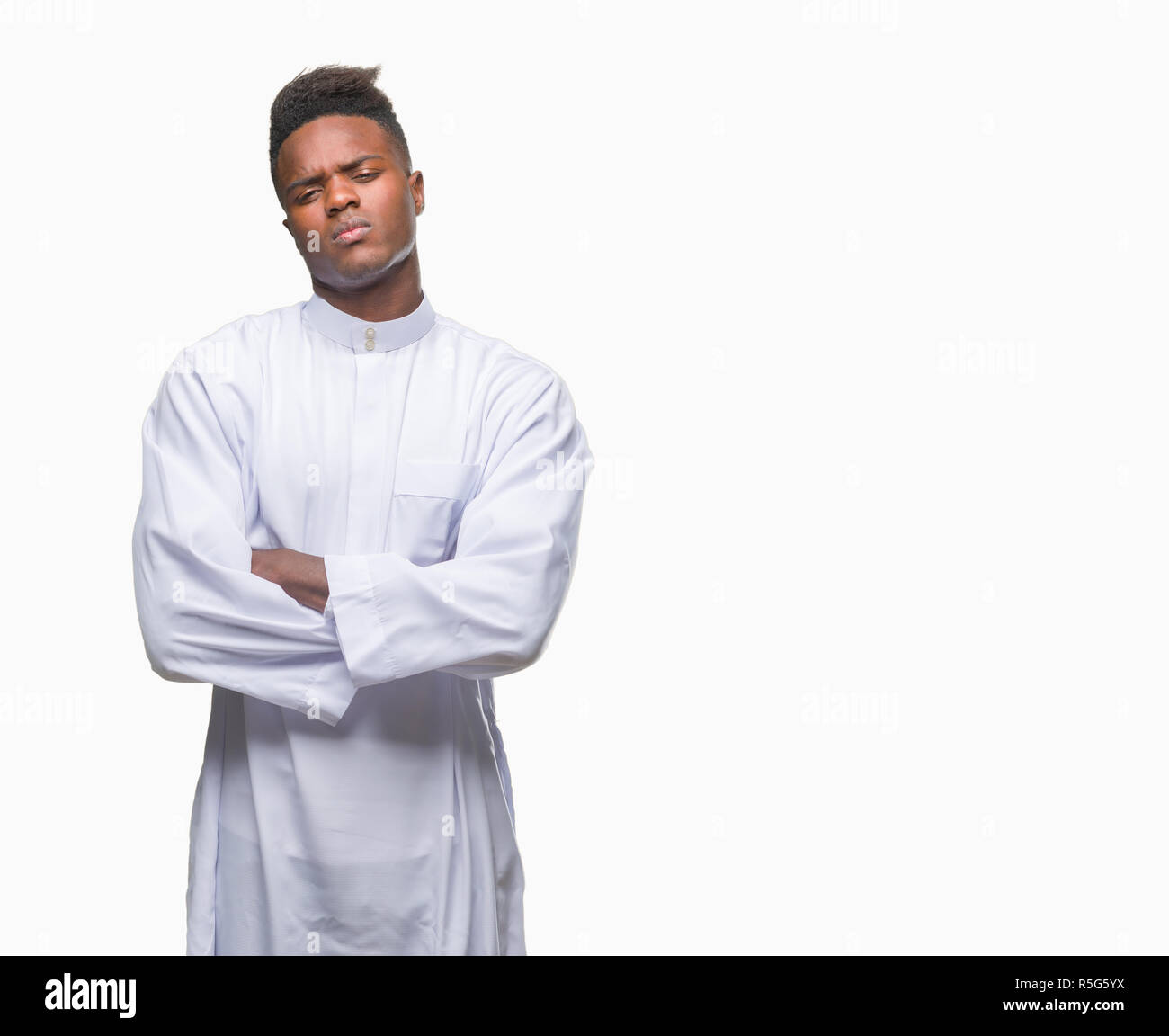 Young arabic african man wearing traditional djellaba over isolated ...