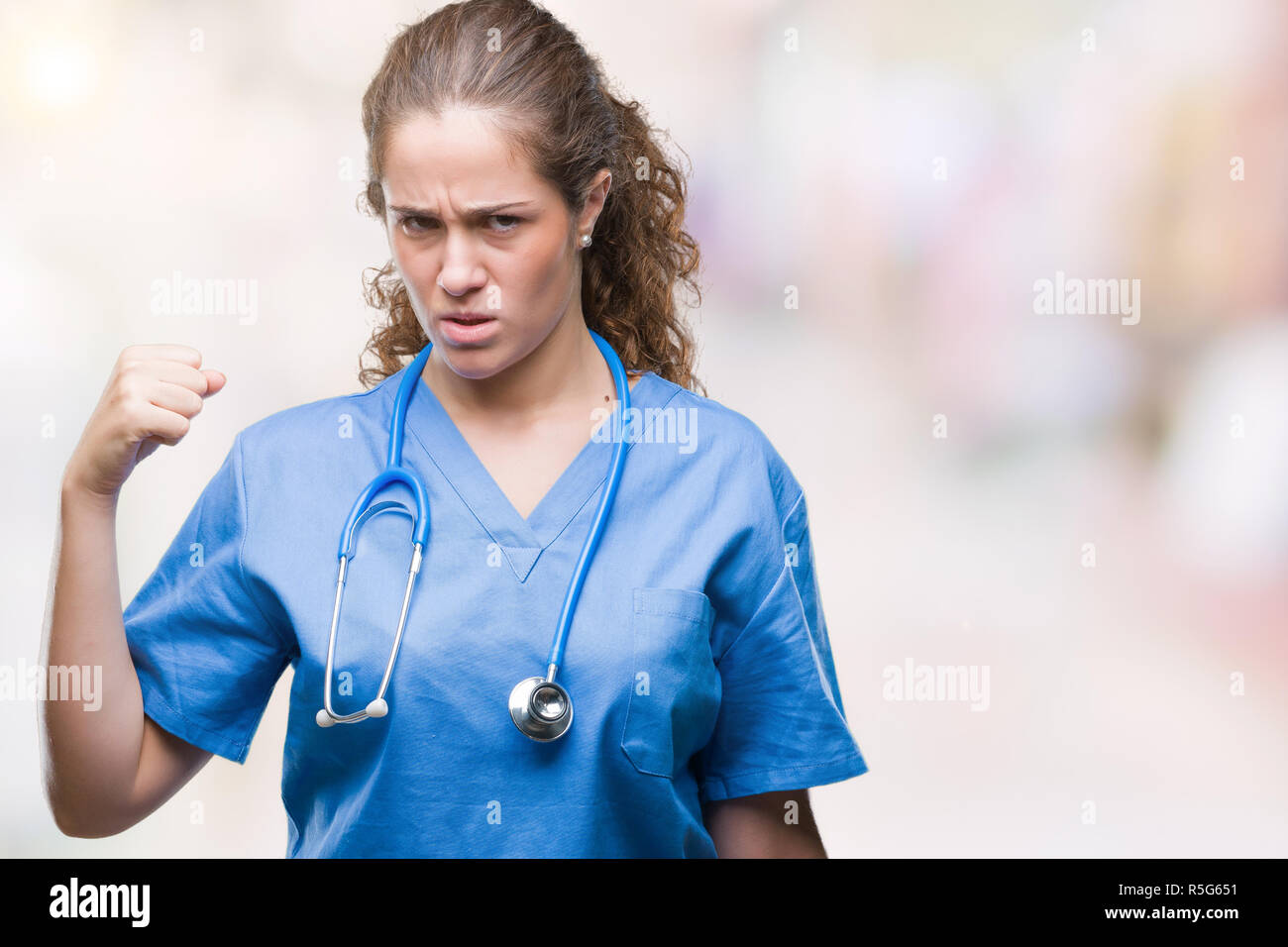 Young brunette doctor girl wearing nurse or surgeon uniform over ...