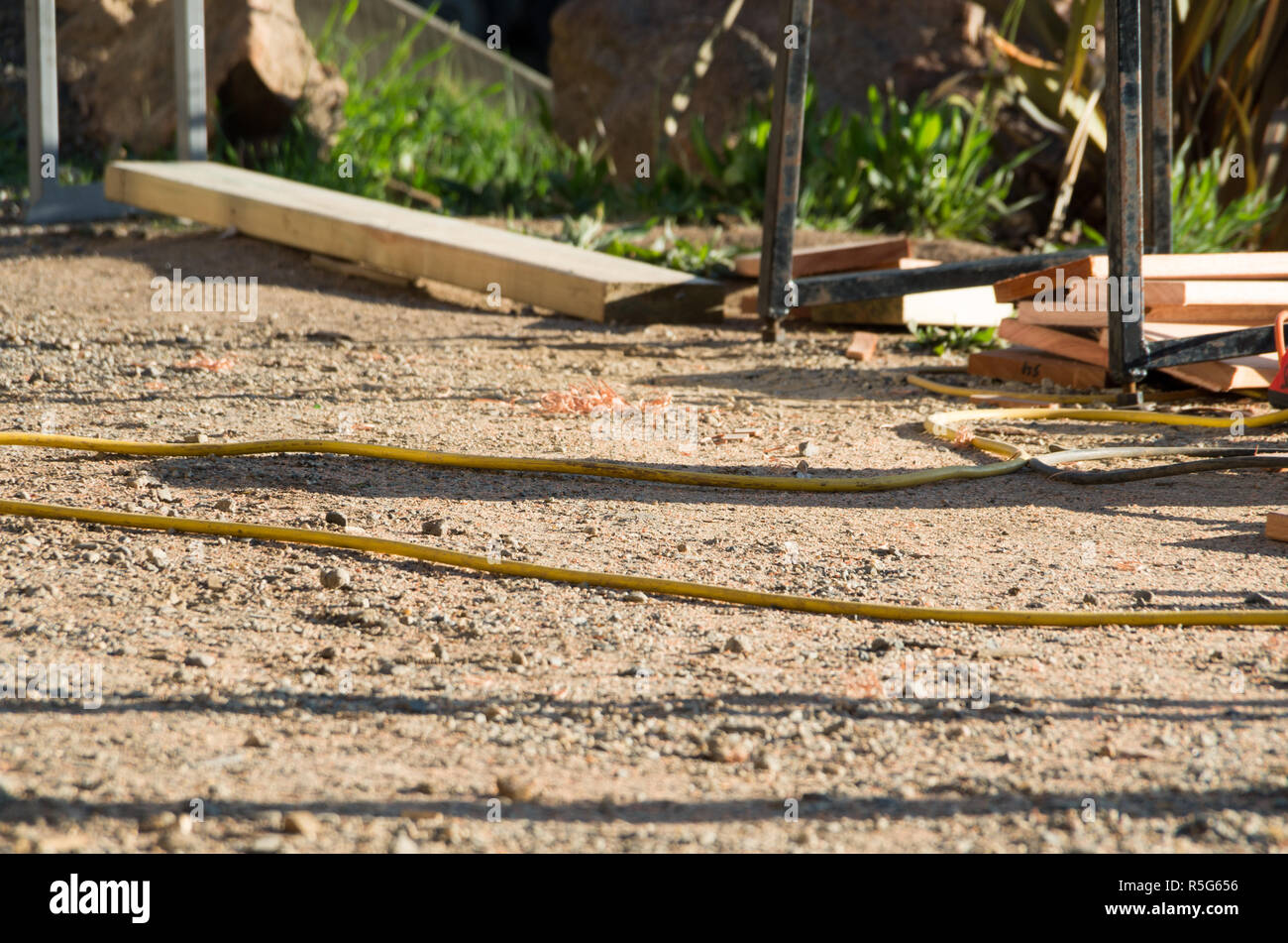 Electrical cable laying in the dirt on a construction site in the sun ...