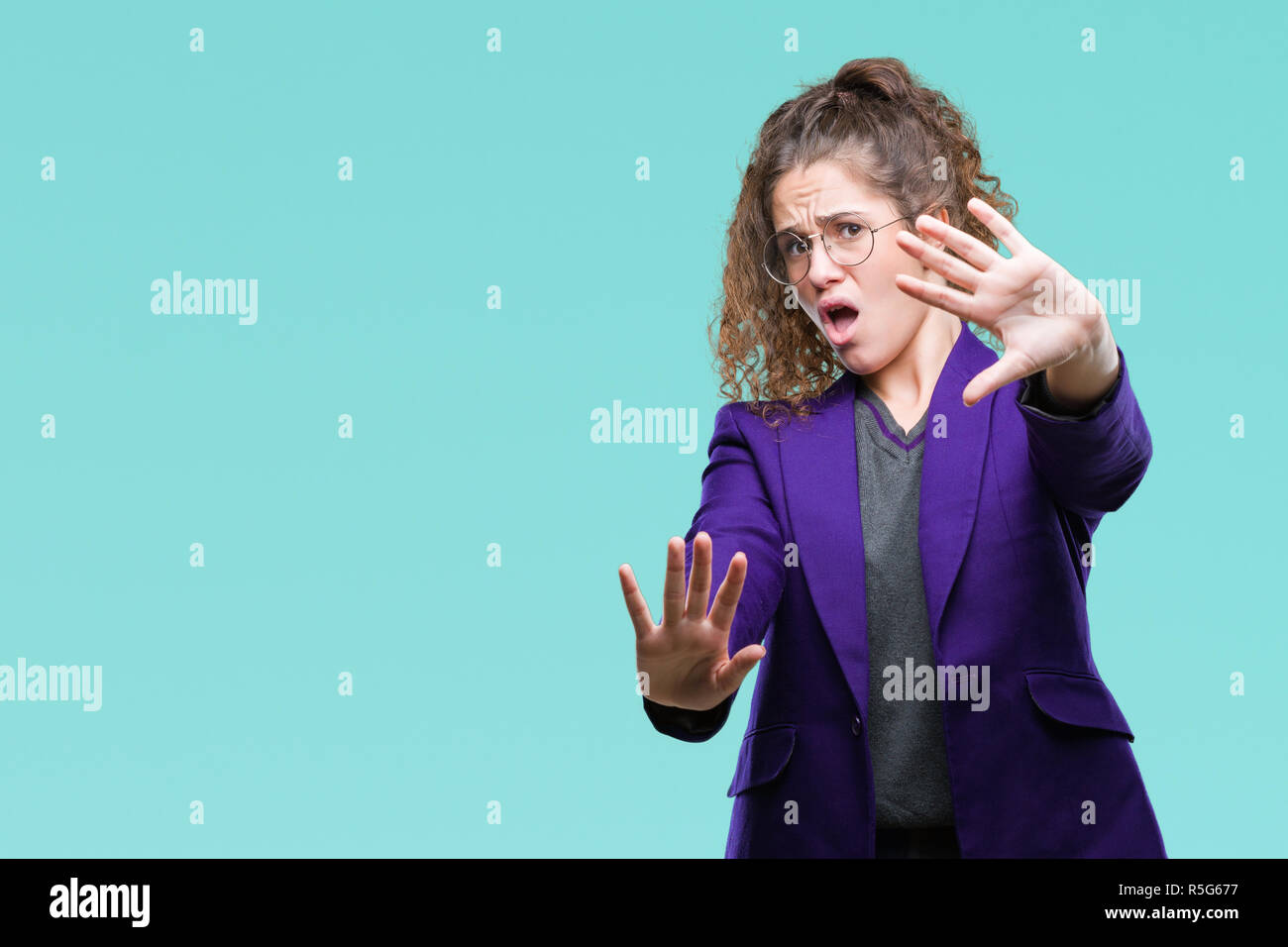 Young brunette student girl wearing school uniform and glasses over ...