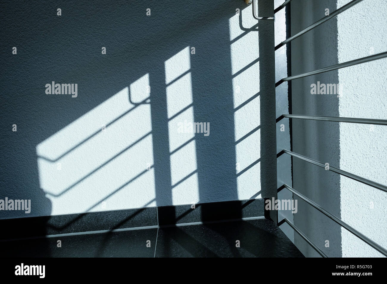 railing in the staircase as a shadow on wall Stock Photo - Alamy