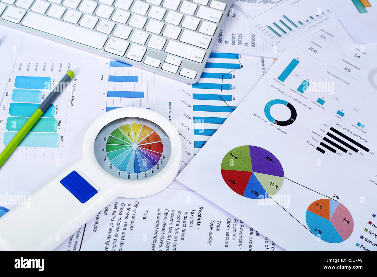 Picture of pencil, magnifying glass and keyboard on the graph paper ...