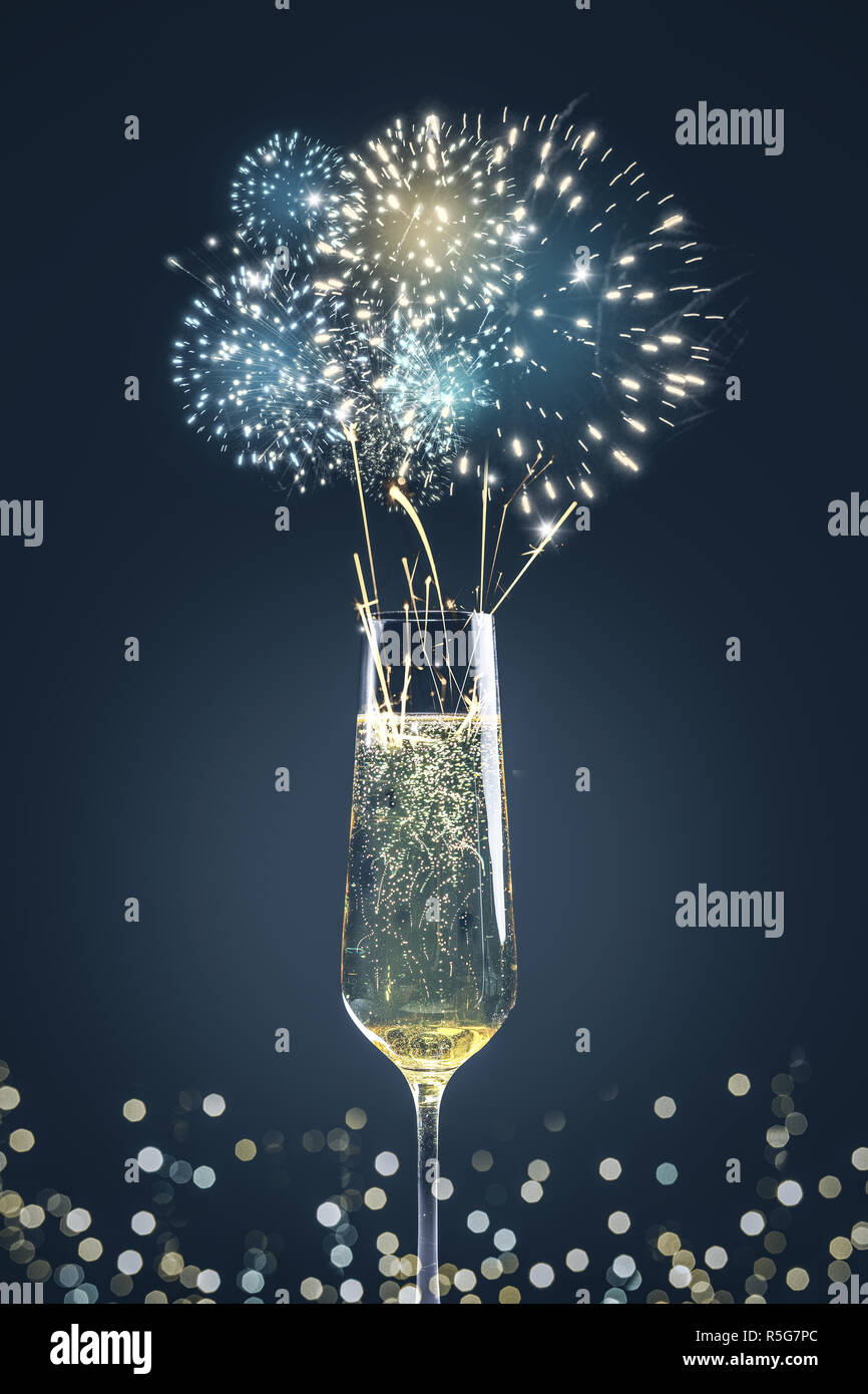 Champagne glass shooting a display of fireworks Stock Photo - Alamy