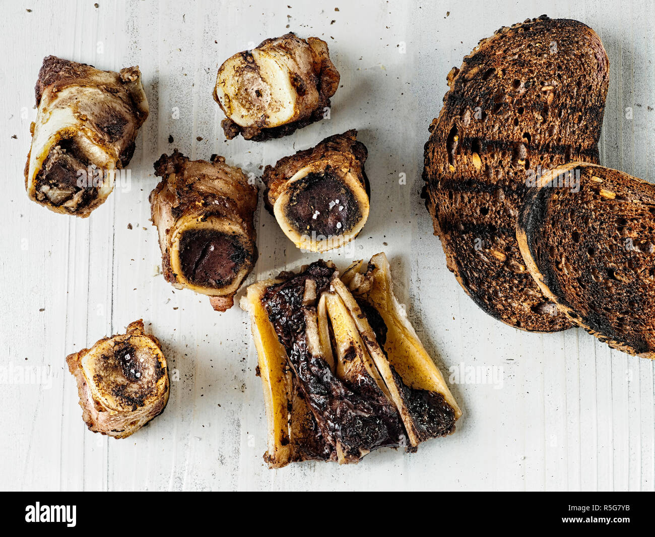 rustic english bone marrow toast Stock Photo - Alamy