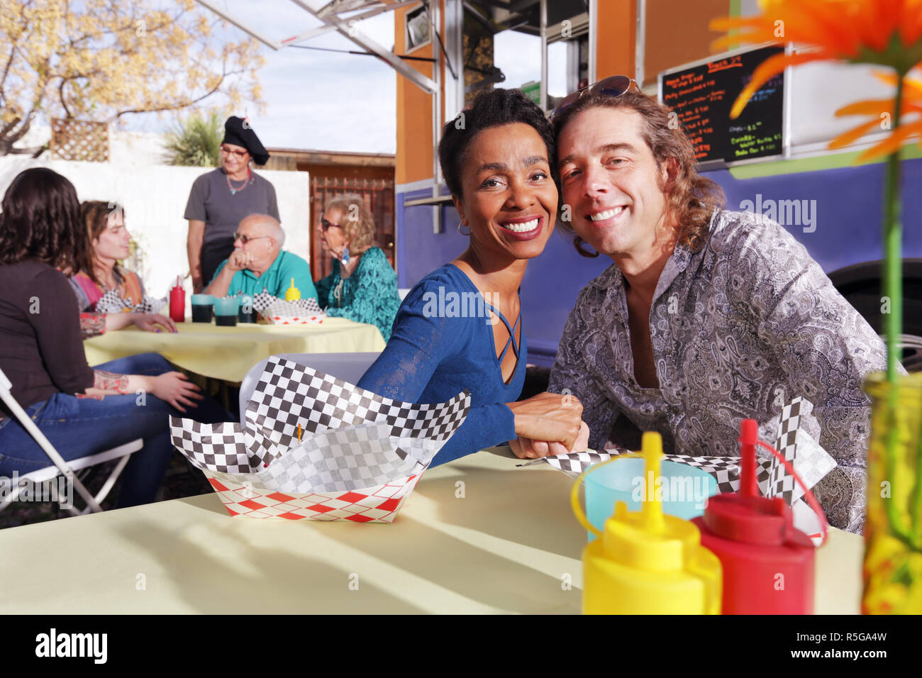 Couple pose cheek to cheek and smile Stock Photo - Alamy