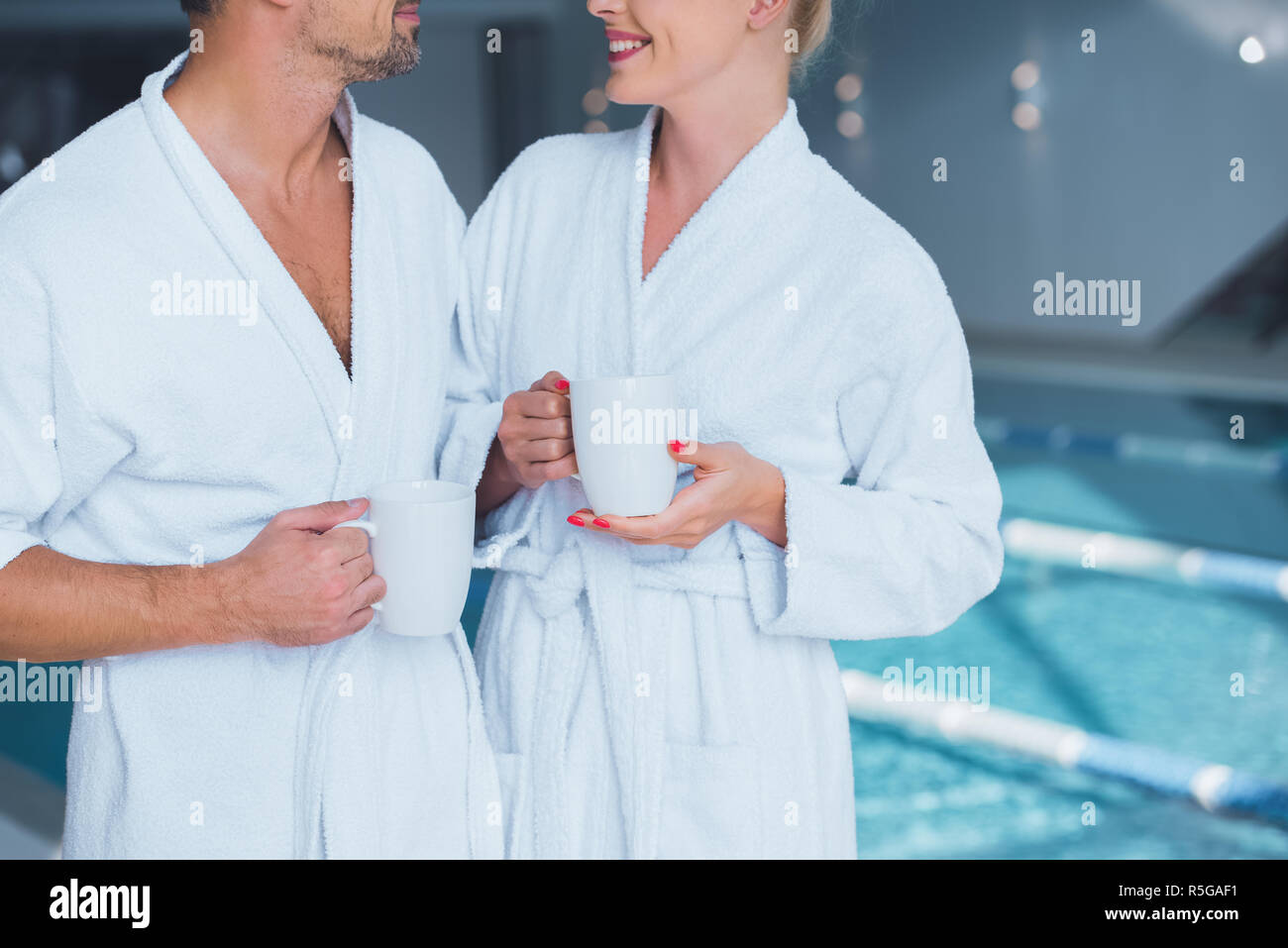 Man standing near swimming pool hi-res stock photography and images - Alamy