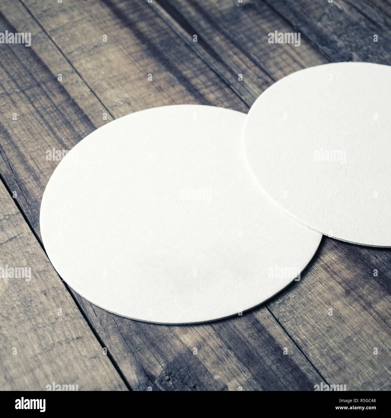 Two beer coasters Stock Photo - Alamy