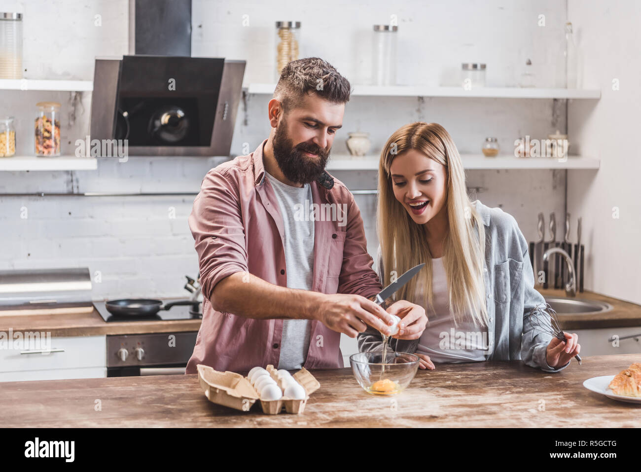 beautiful smiling couple preparing breakfast together Stock Photo - Alamy