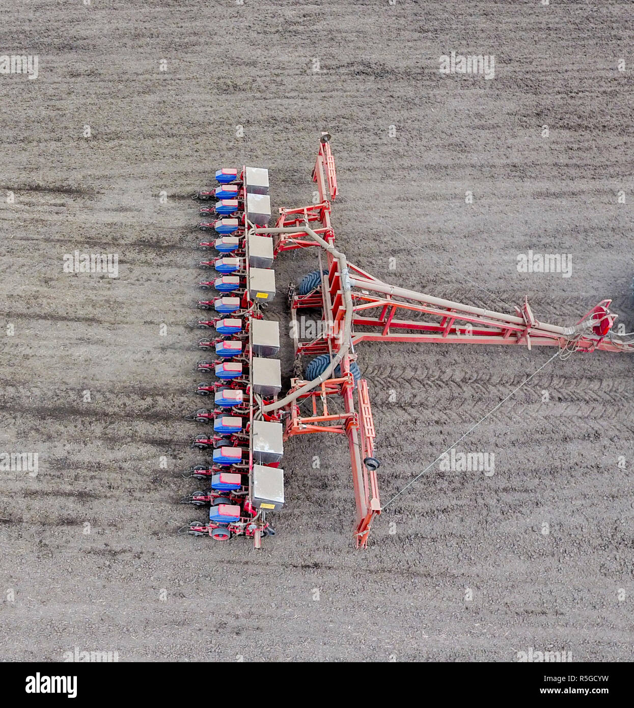 Corn seeder. Sowing on the field with a seeder of corn Stock Photo - Alamy