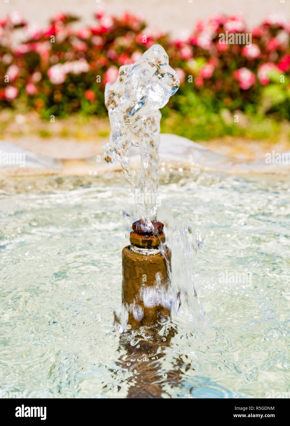 Water flwoing out of a fountain Stock Photo - Alamy