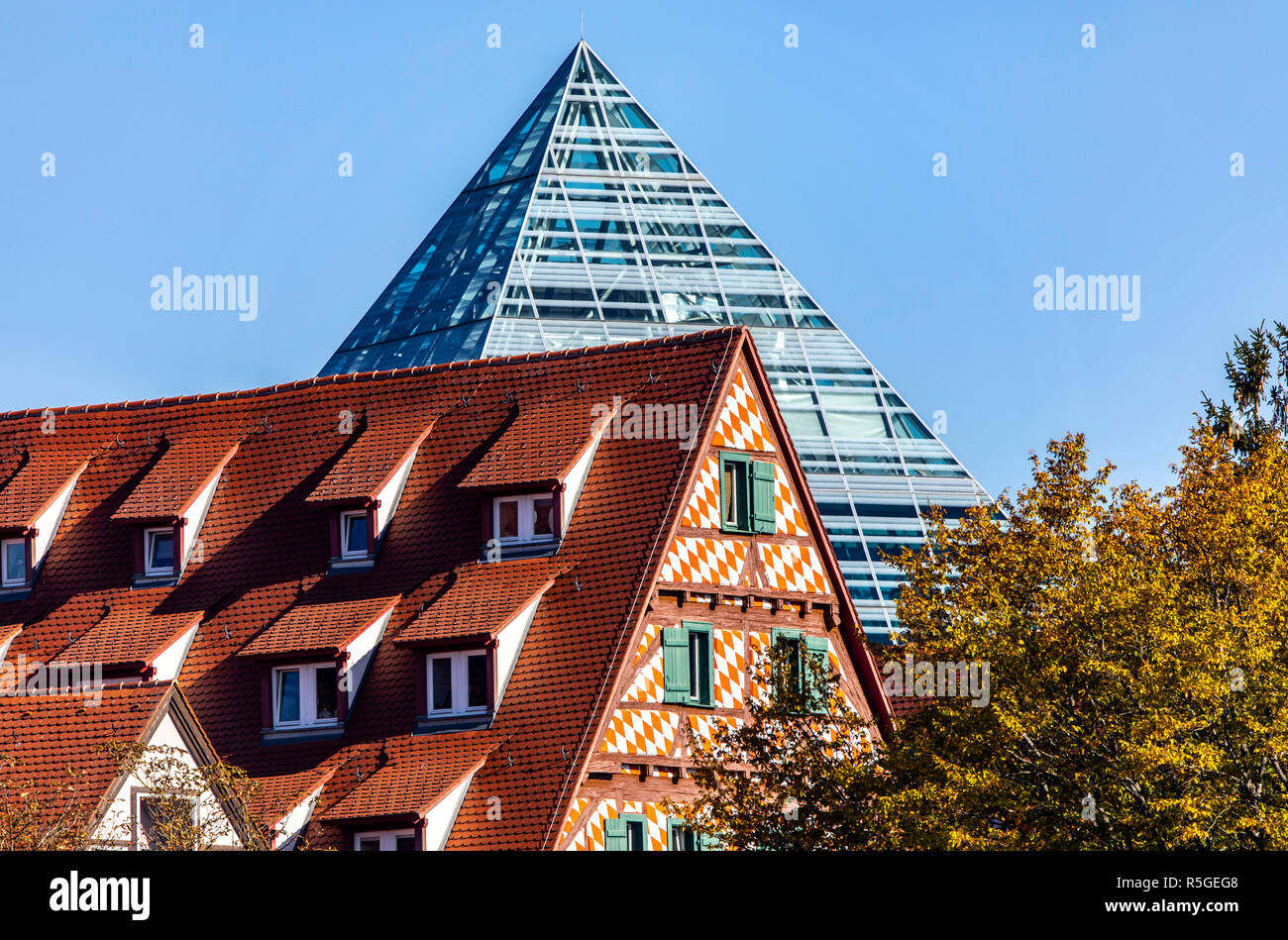 Traditional half-timbered house in the old town, glass and steel ...