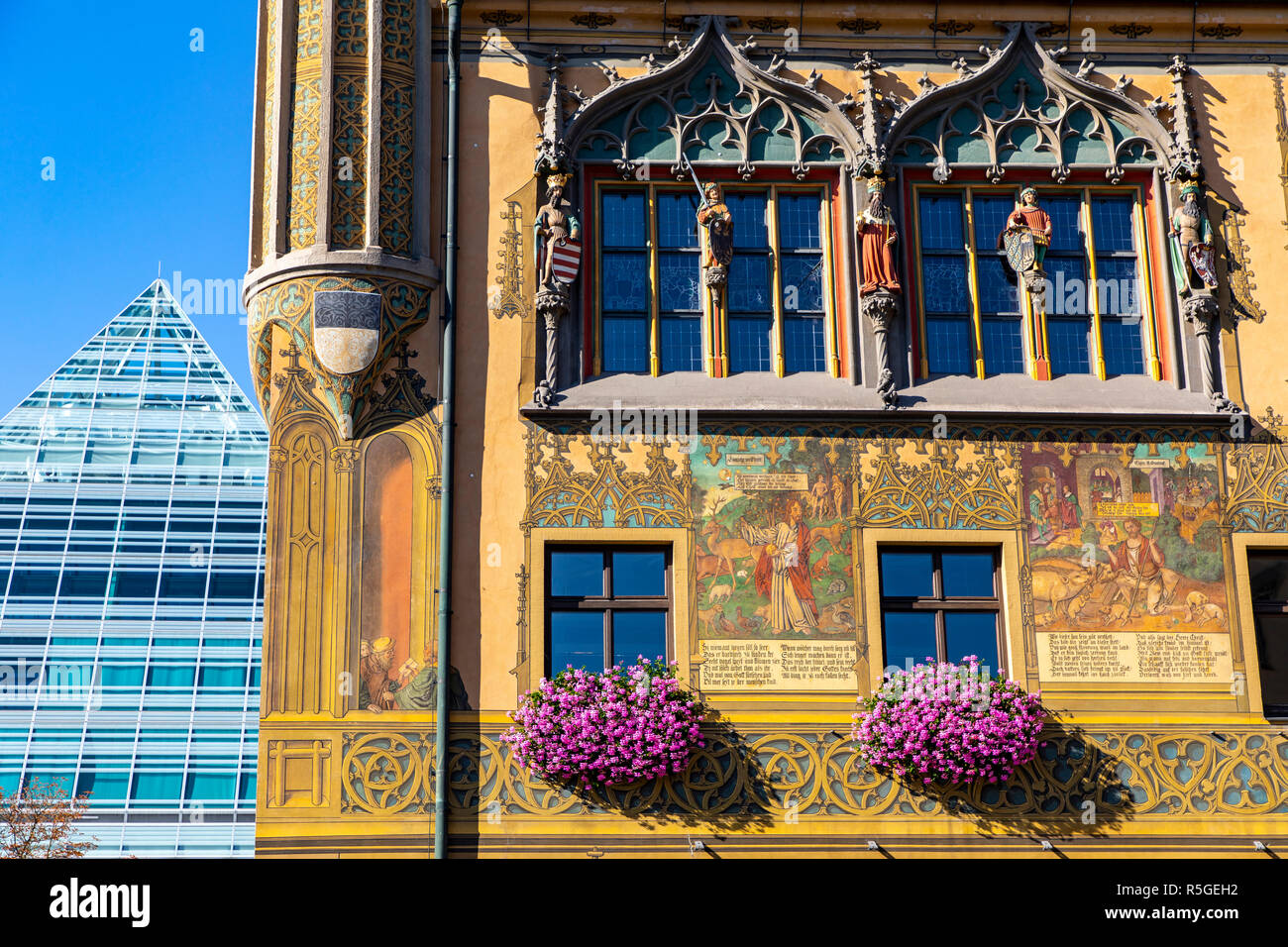 Modern building, pyramid of the new city library, historic town hall ...