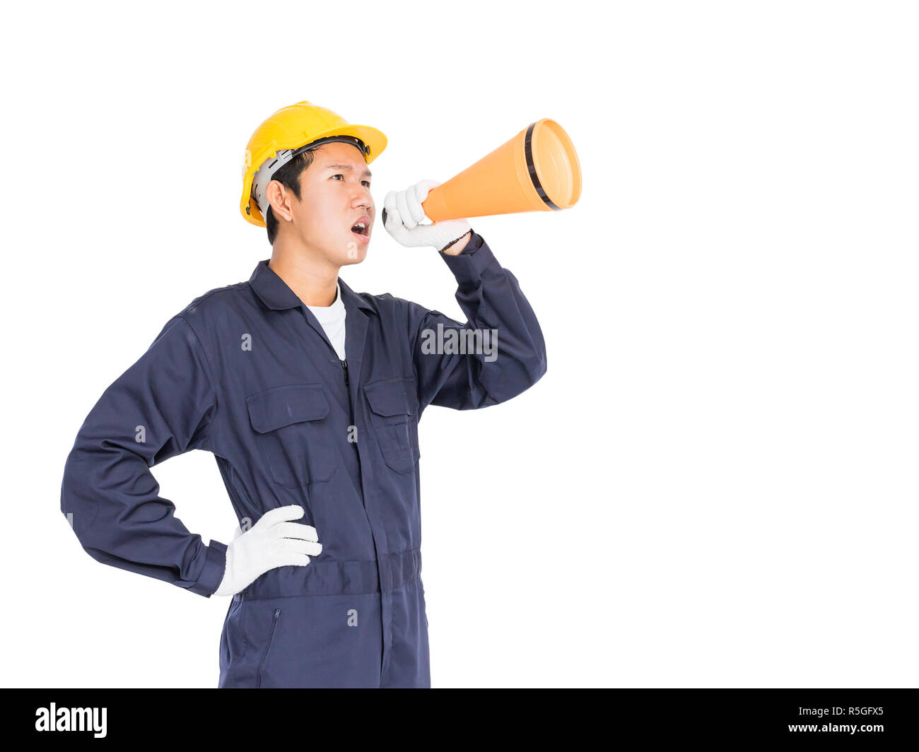 Young worker shouting for announce through a megaphone Stock Photo - Alamy