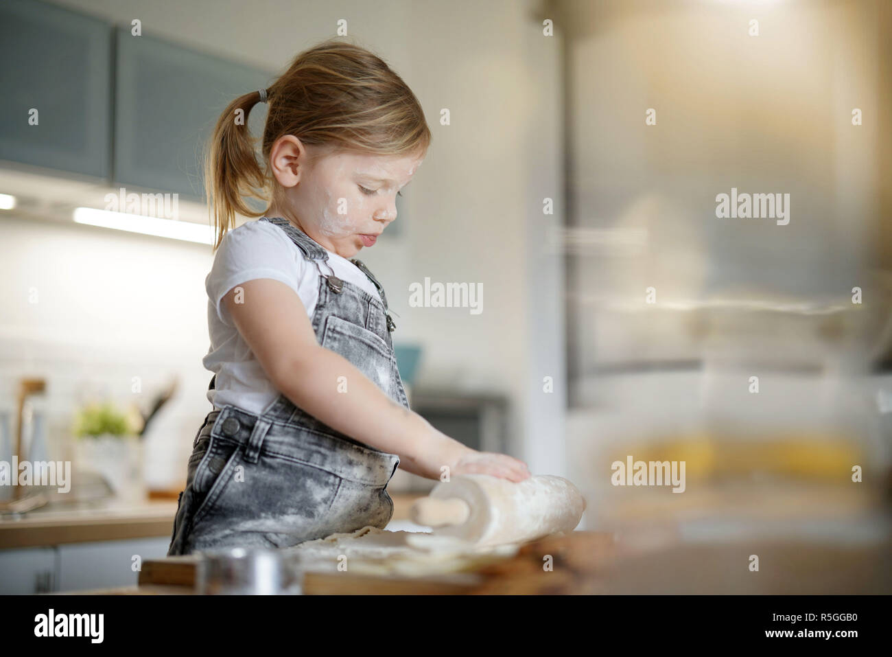 Happy child baking at home Stock Photo - Alamy