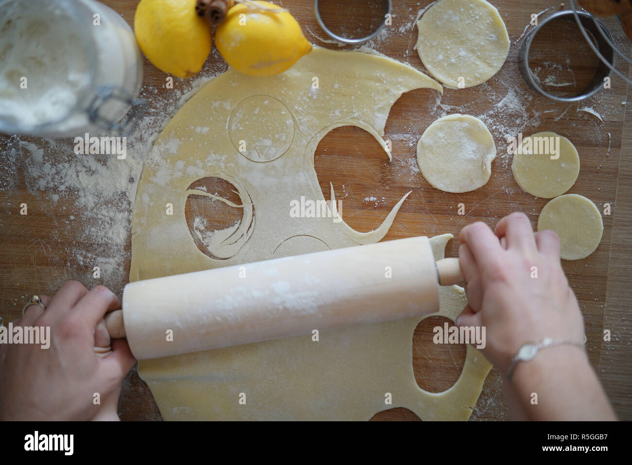 Bird's eye view of mother and daughter rolling pastry Stock Photo - Alamy
