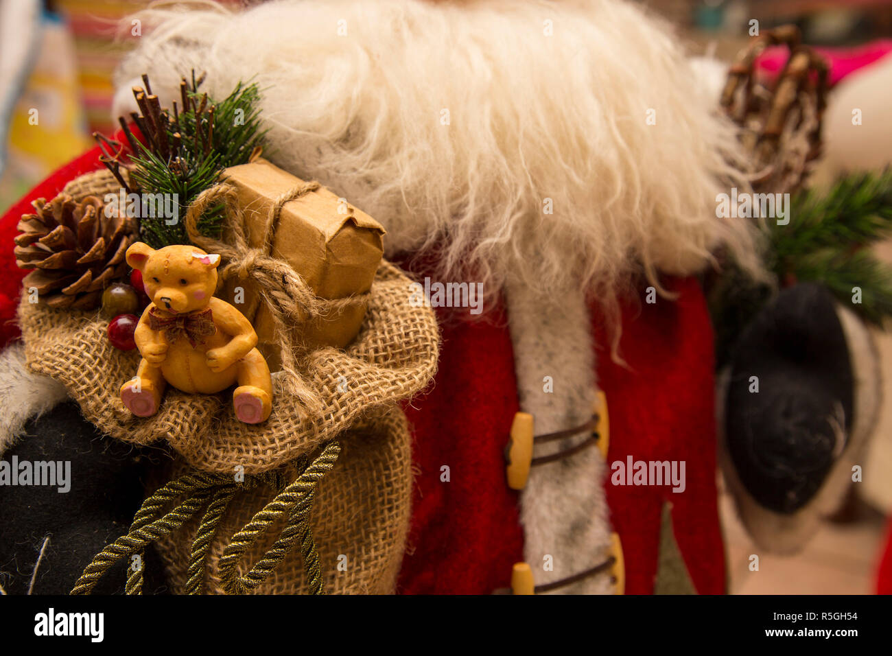 close up sack of presents with santa claus background Stock Photo - Alamy