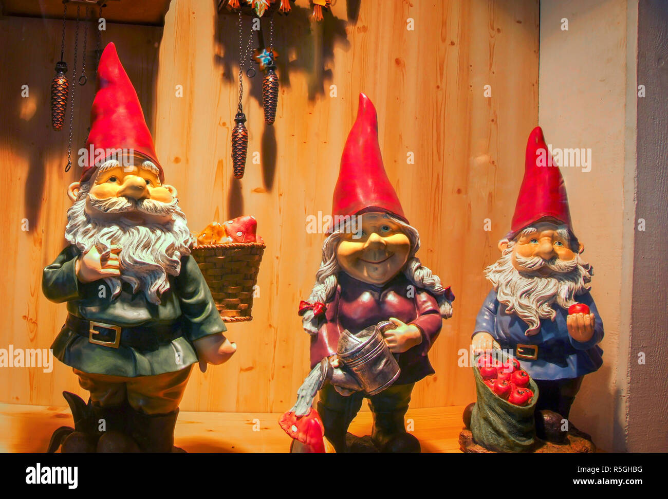 three gnomes with red hat.jpg Stock Photo - Alamy