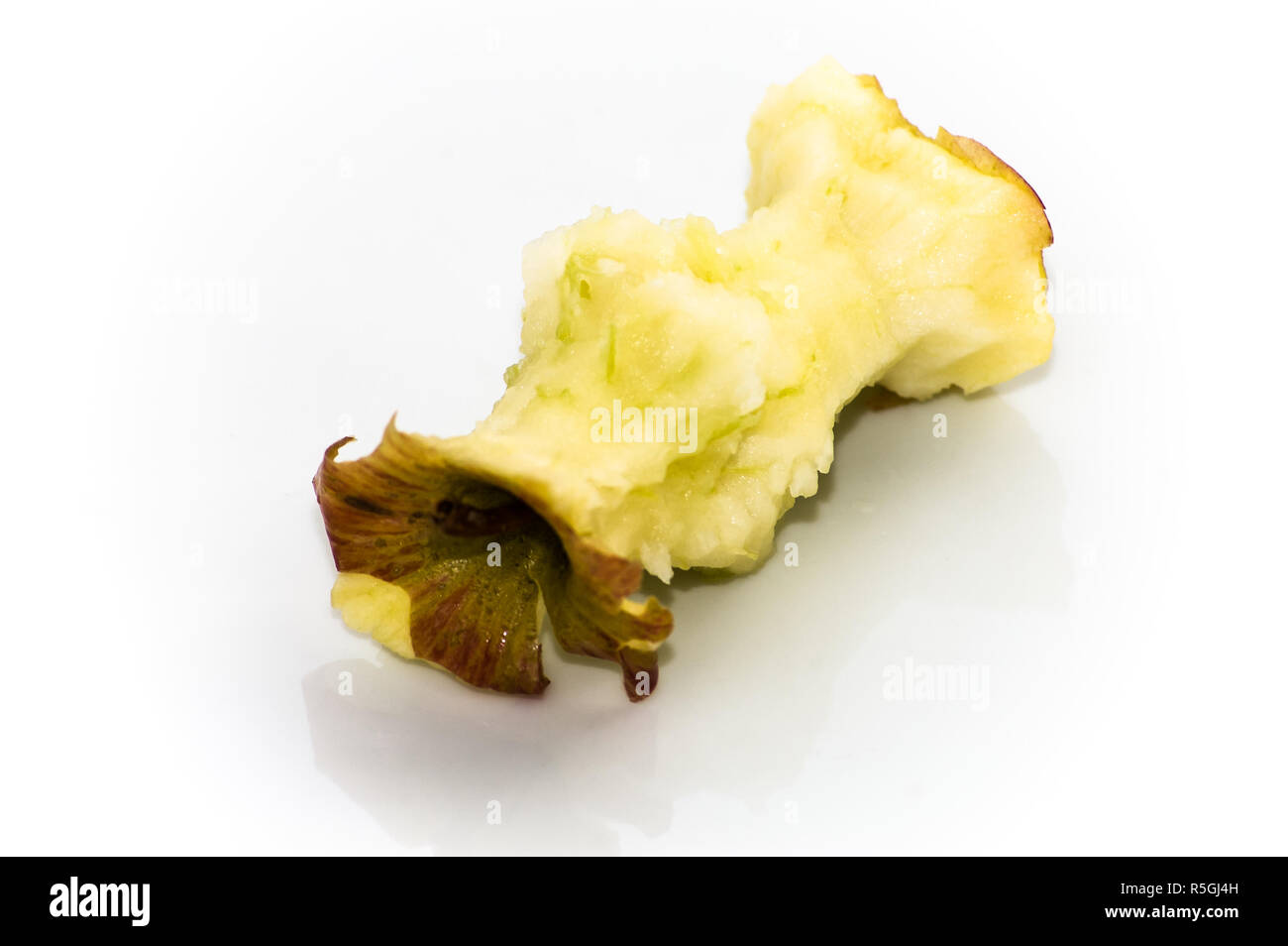 Apple core on a white background Stock Photo - Alamy