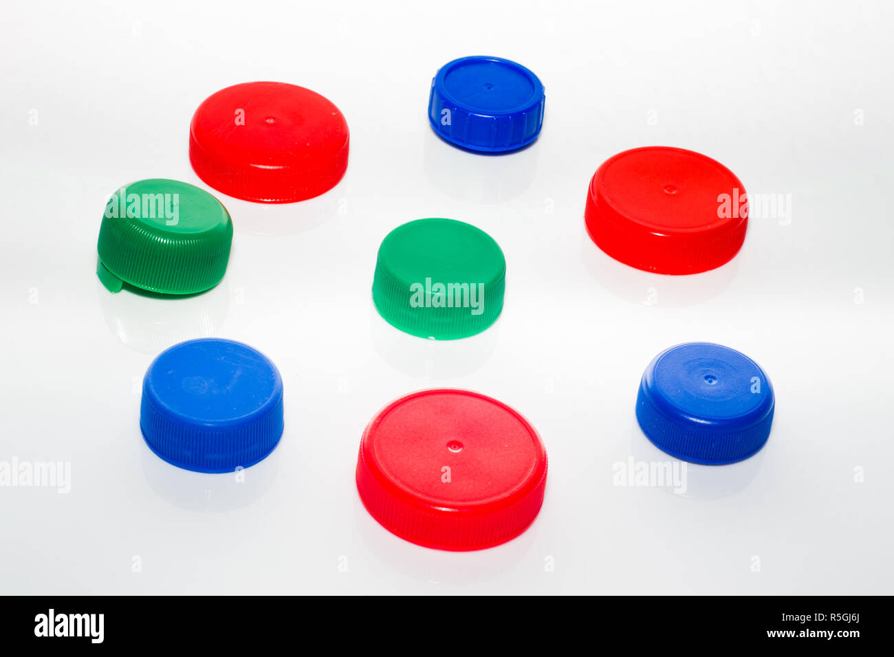 Colorful plastic cap on a white background Stock Photo - Alamy